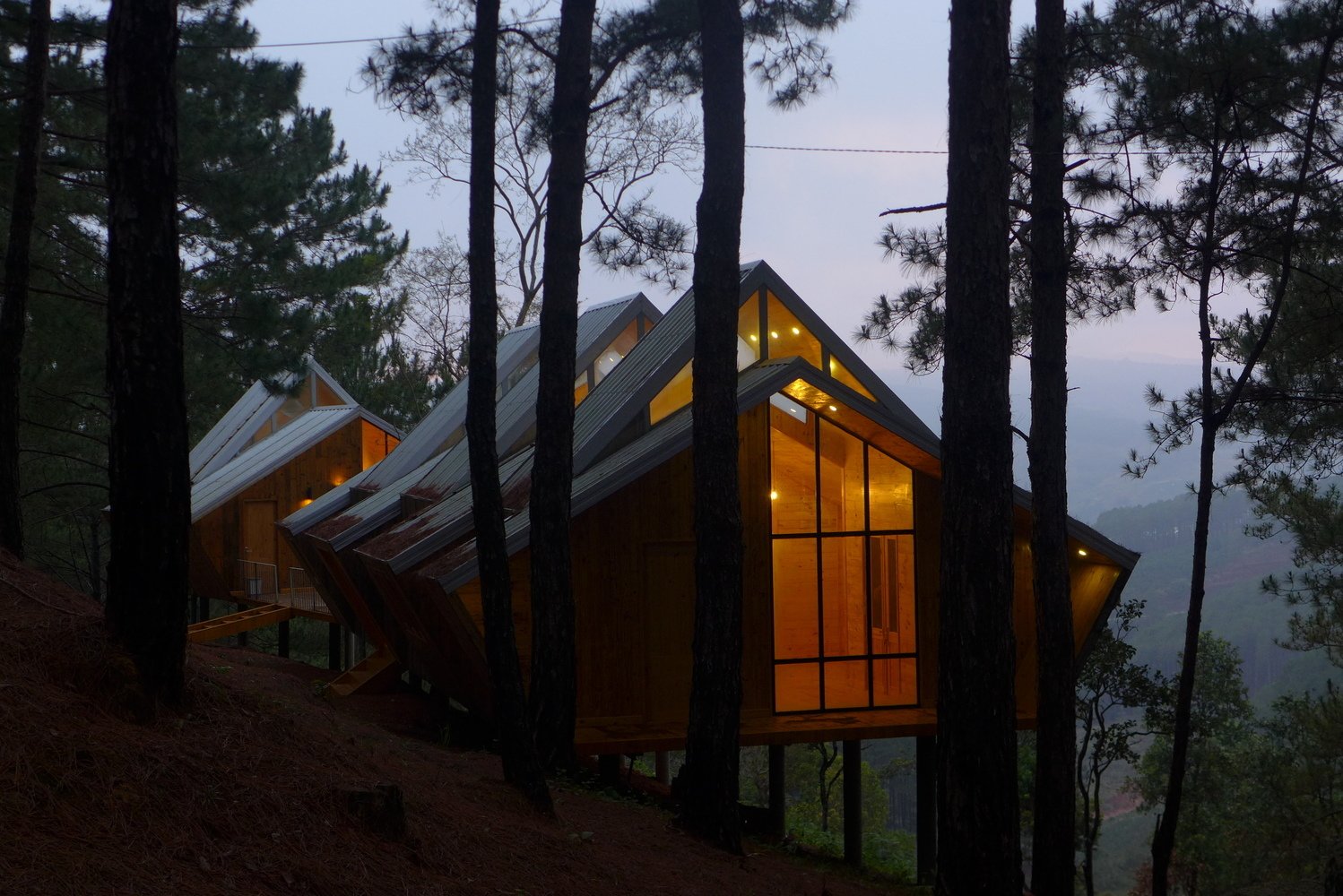 Photo 7 of 10 in These Geometric Cabins Glow Like Lanterns in a ...