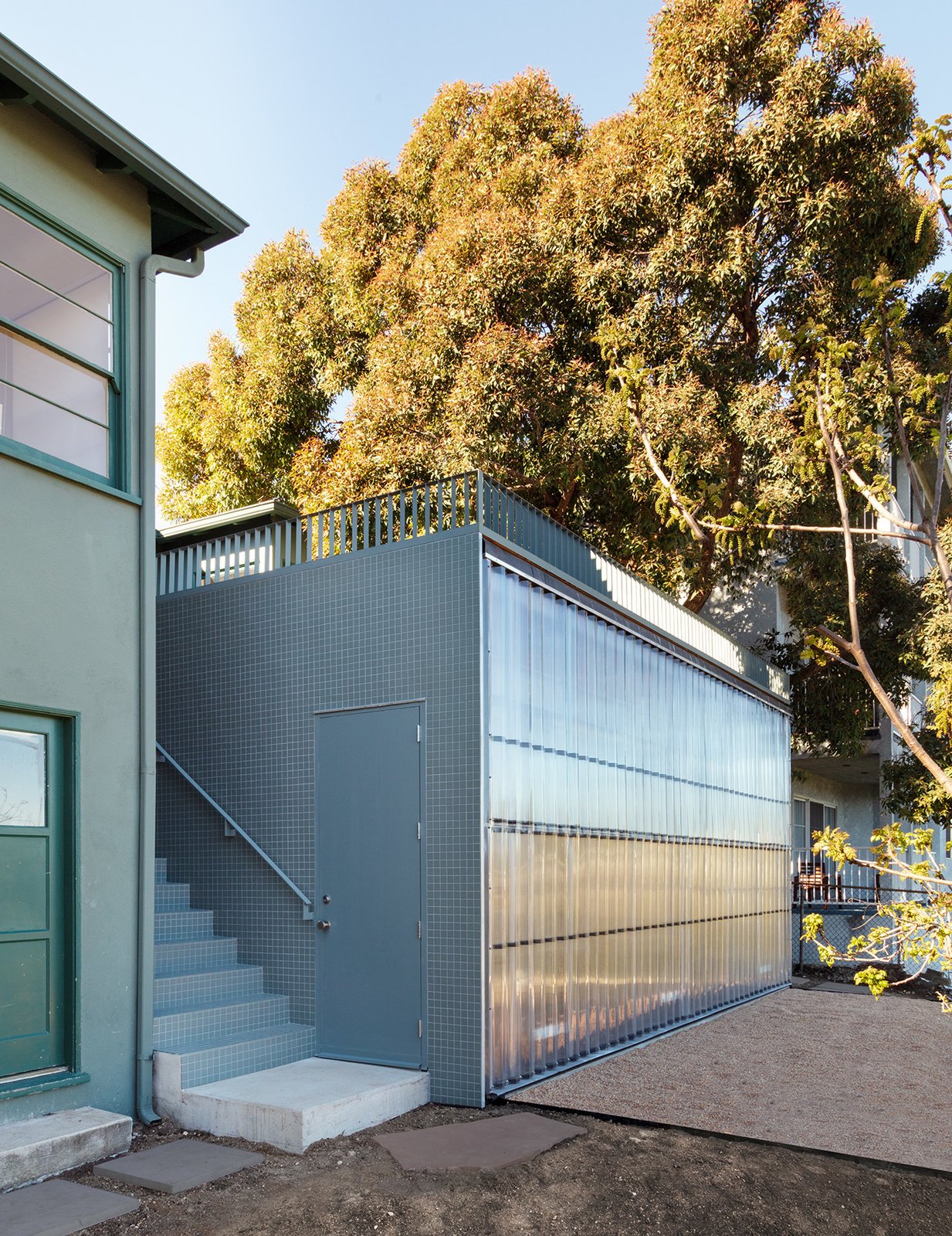 Photo 5 of 8 in A Corrugated, Plastic Bifold Door Opens Up an Artist’s ...