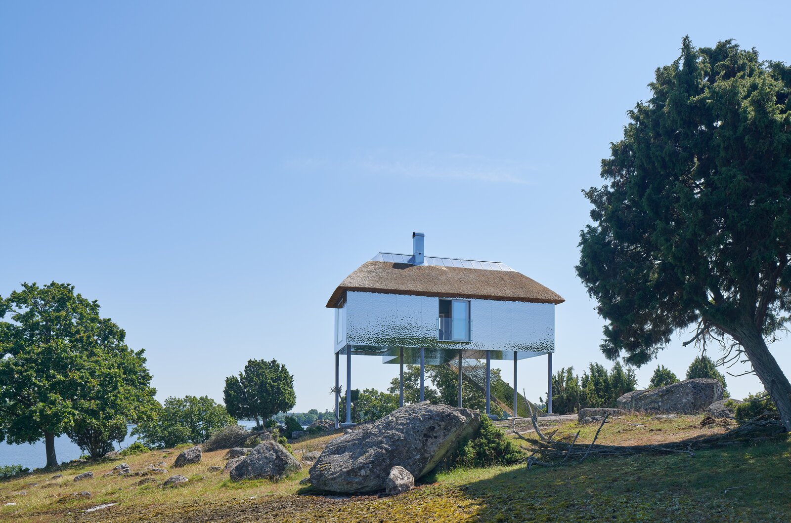 Photo 1 of 9 in A Surreal Mirrored Cabin Stands High Above the Earth in ...