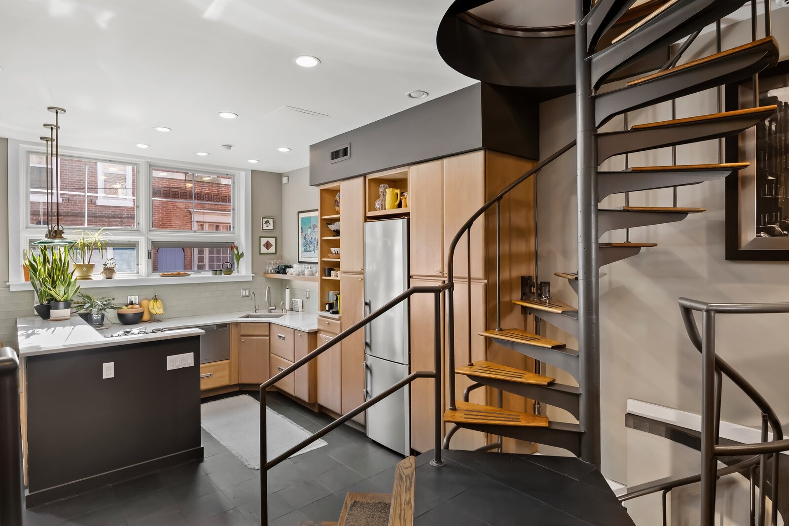 Photo 5 of 10 in A Charming Brick Townhouse With a Spiral Staircase ...