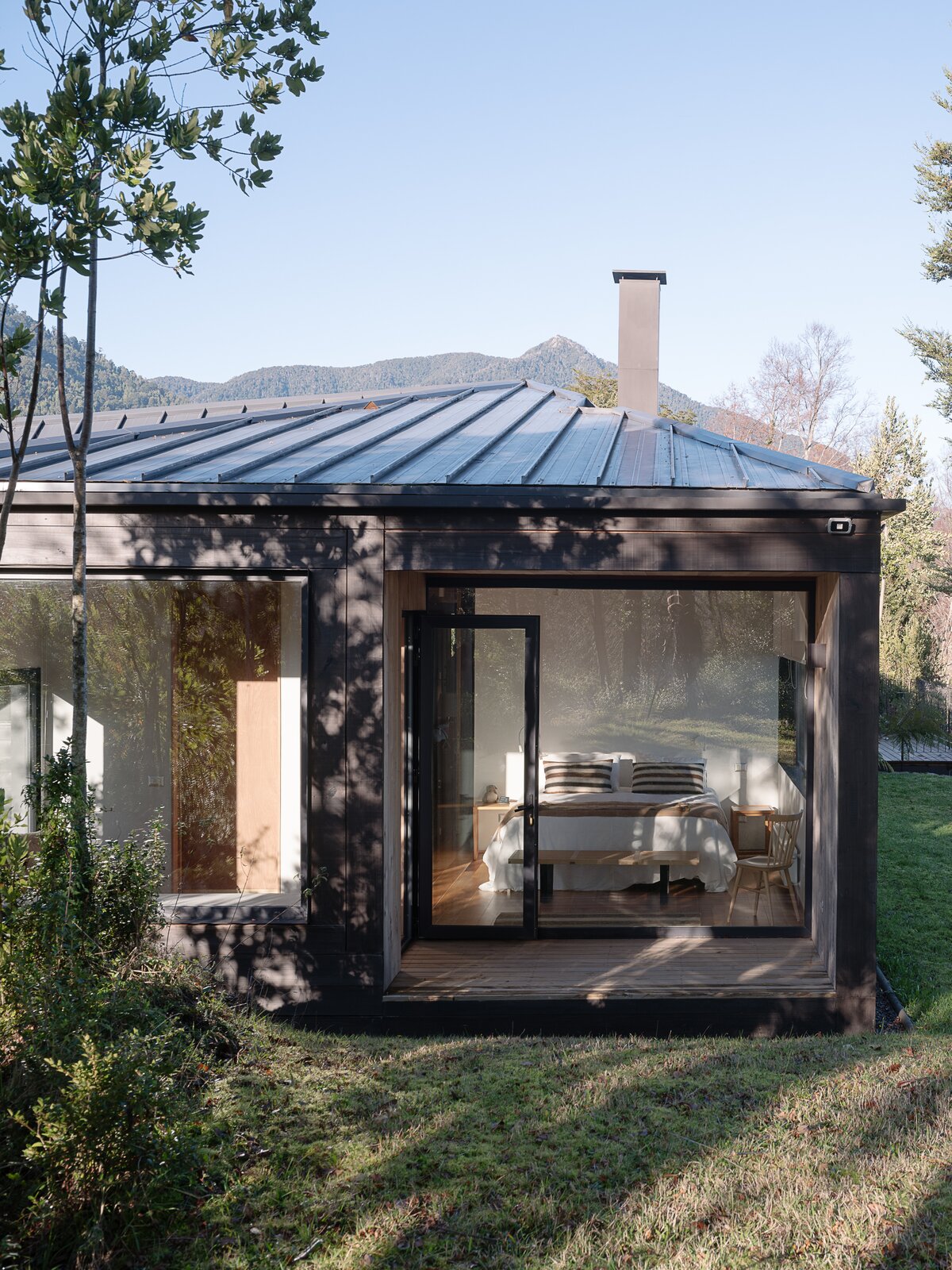 Photo 14 of 17 in A T-Shaped Cabin Hugs a Forested Hillside in Chile ...