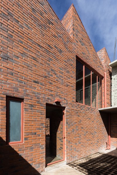 Exterior Brick Siding Material Sawtooth Roofline Design Photos and… - Dwell