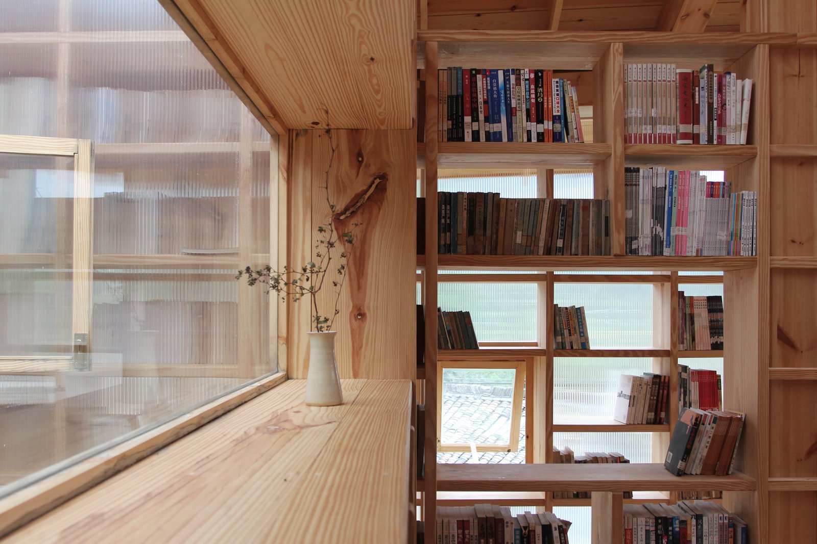 Photo 14 of 19 in A Transparent Library Gleams at the Center of a ...