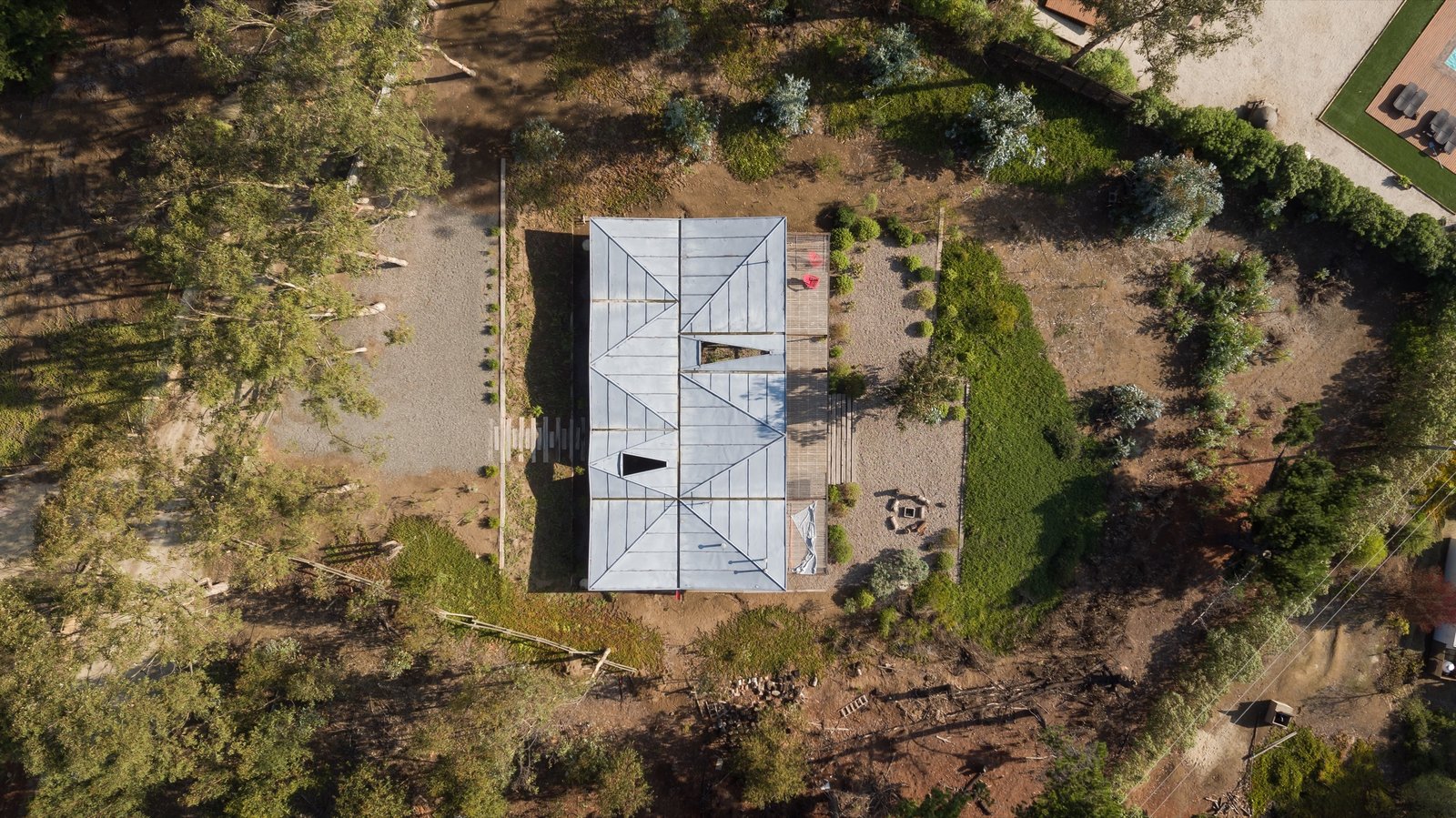 Photo 11 of 12 in This Chilean Home’s Folded Metal Roof Recalls the Art ...
