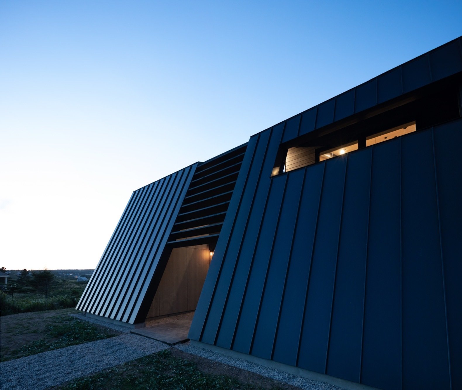 Photo 16 of 19 in A Folded Steel Roof Shields a Fortress-Like Abode in ...