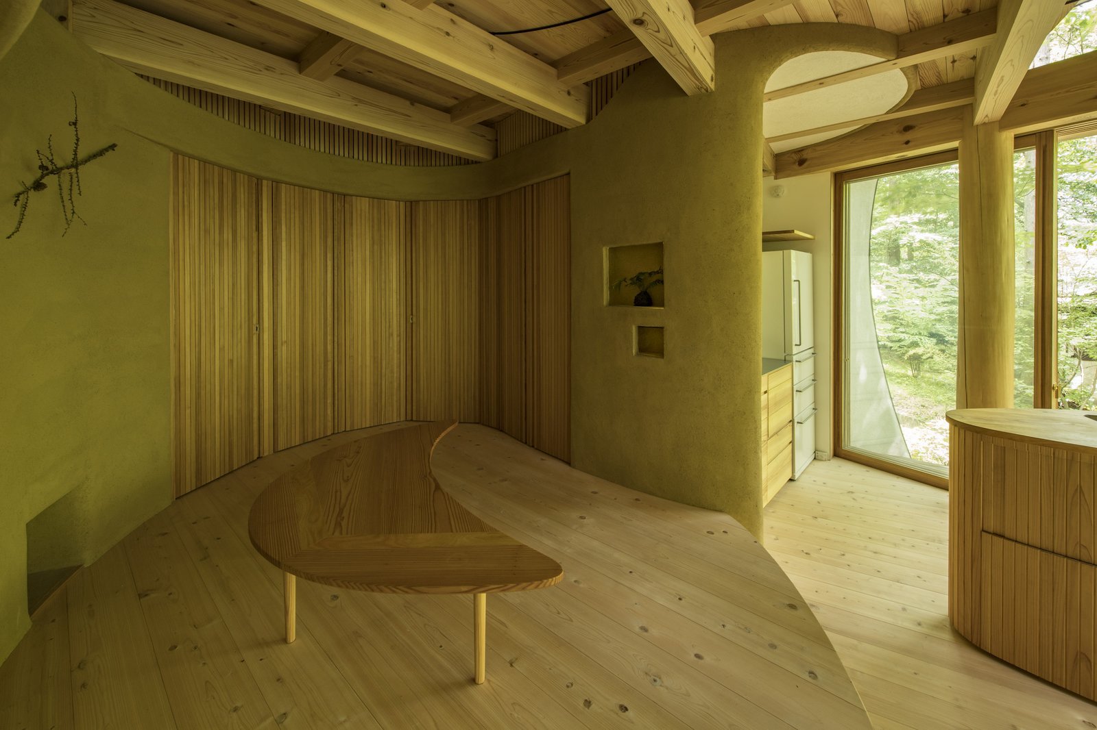 Photo 12 of 24 in This Curvaceous Timber and Earth Cabin Blends Into a ...