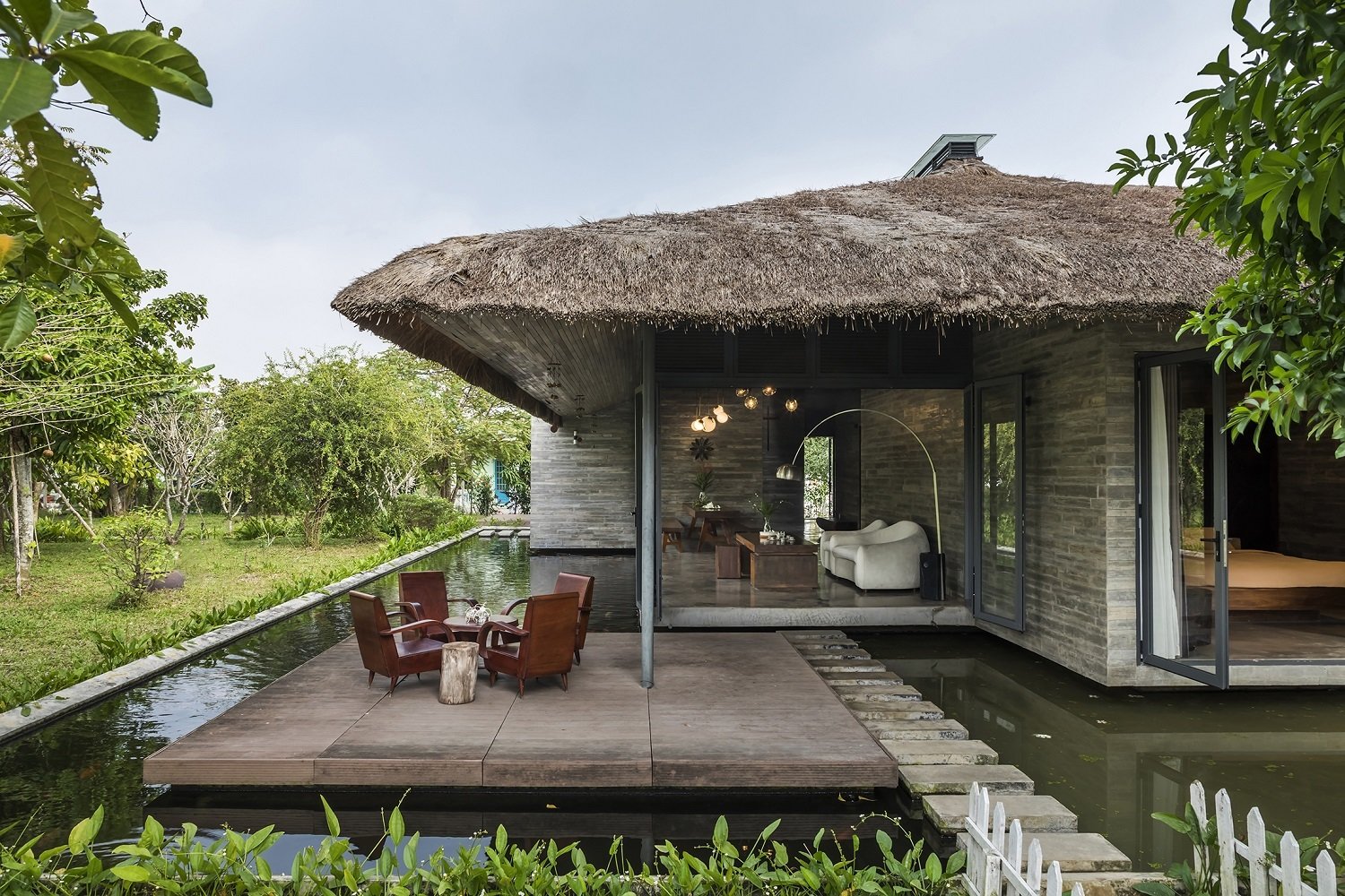 Photo 2 of 16 in A Koi-Filled Moat Surrounds This Vietnamese House from ...