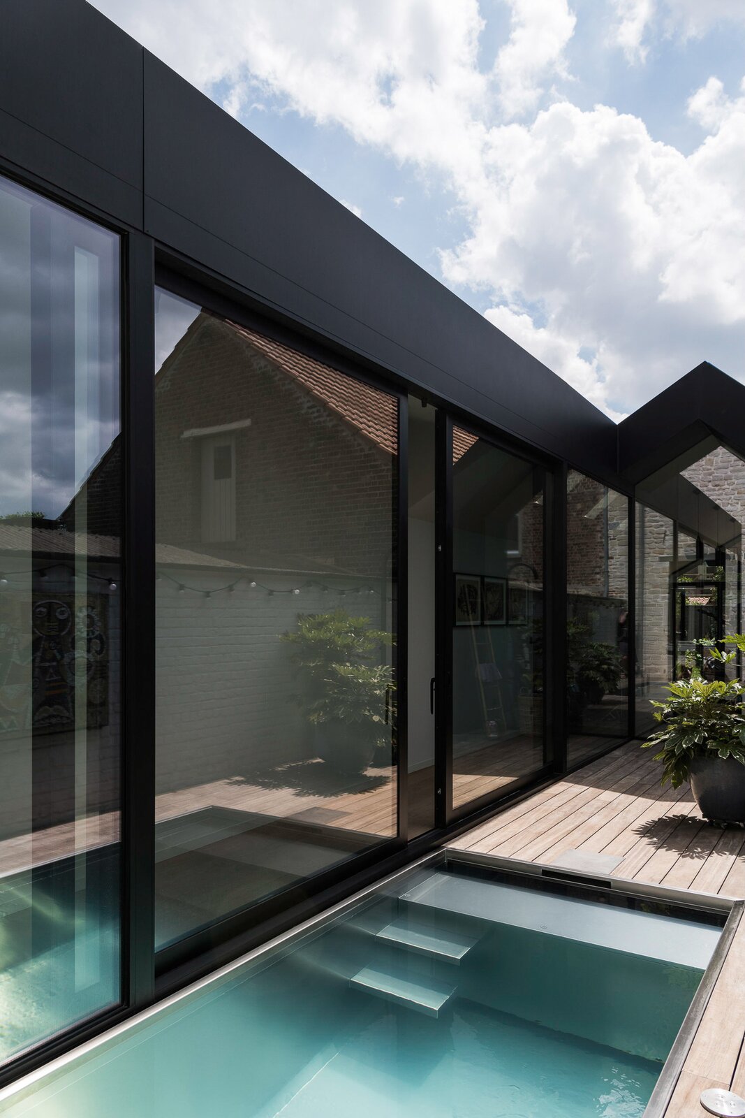Photo 3 of 11 in An Extension With a Pool Links a Narrow Belgian Home ...