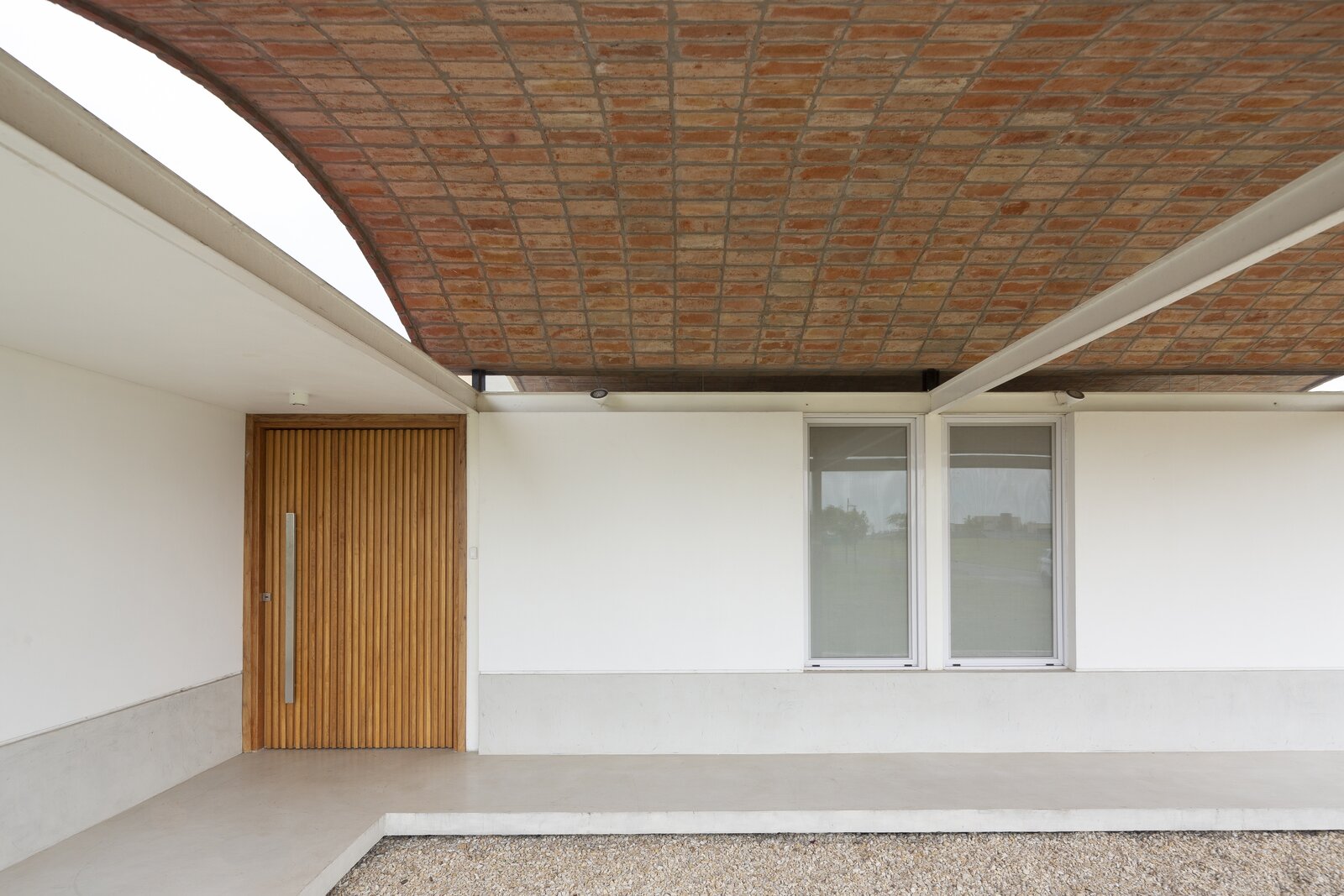 Photo 4 of 15 in A Rippling Brick Roof Caps a Sun-Kissed Home in ...