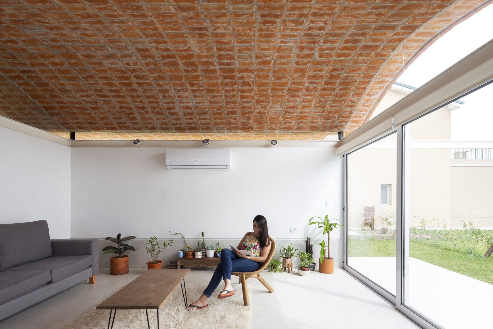 Photo 6 of 15 in A Rippling Brick Roof Caps a Sun-Kissed Home in ...