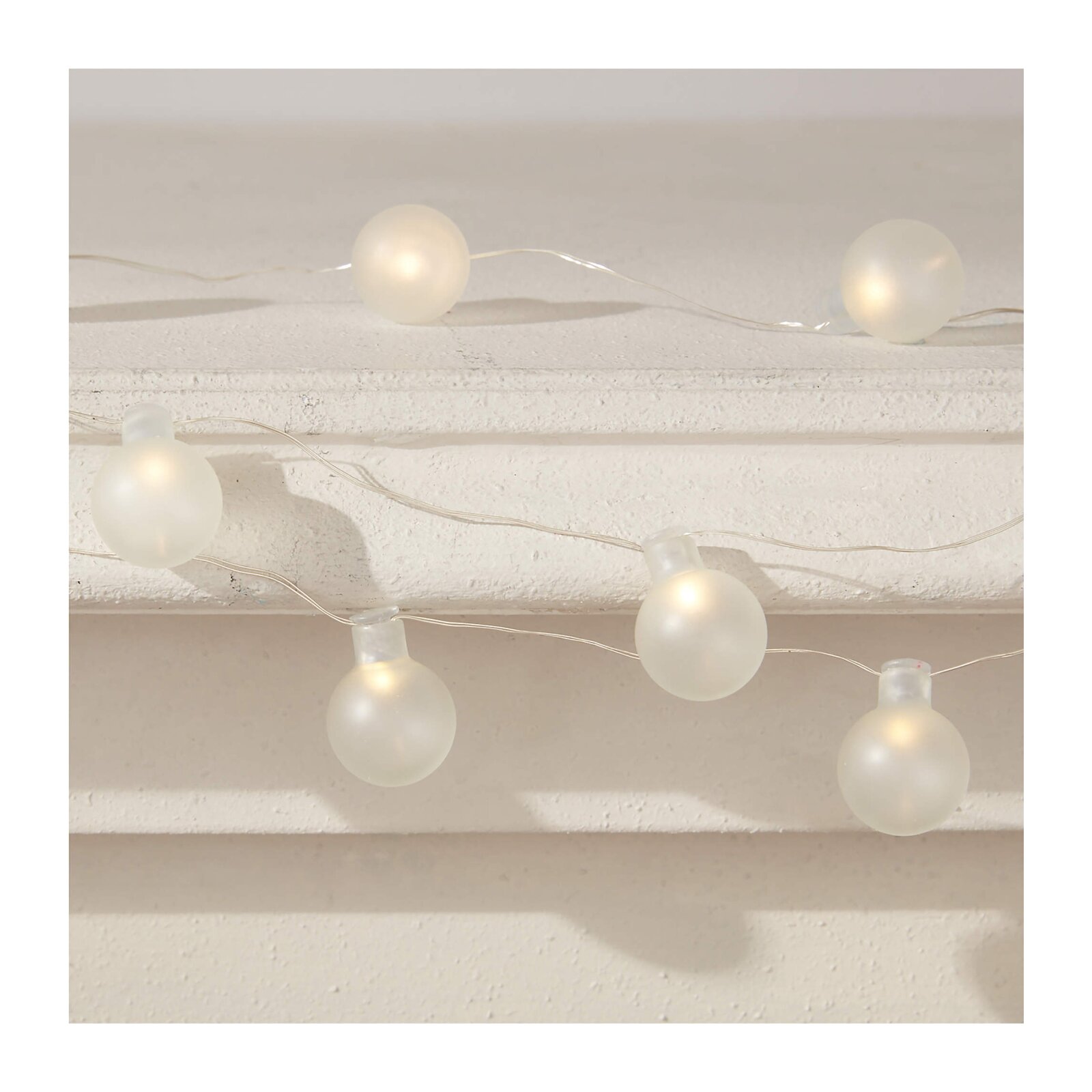 Mini Frosted Glass String Lights by CB2 - Dwell