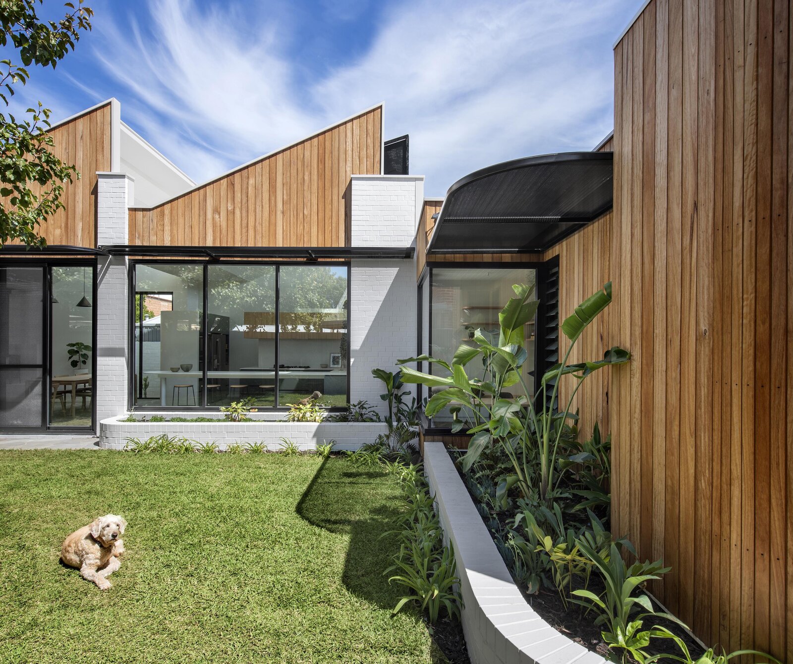 Photo 1 of 14 in A Sawtooth Roofline Meets Deco-Inspired Curves at This ...