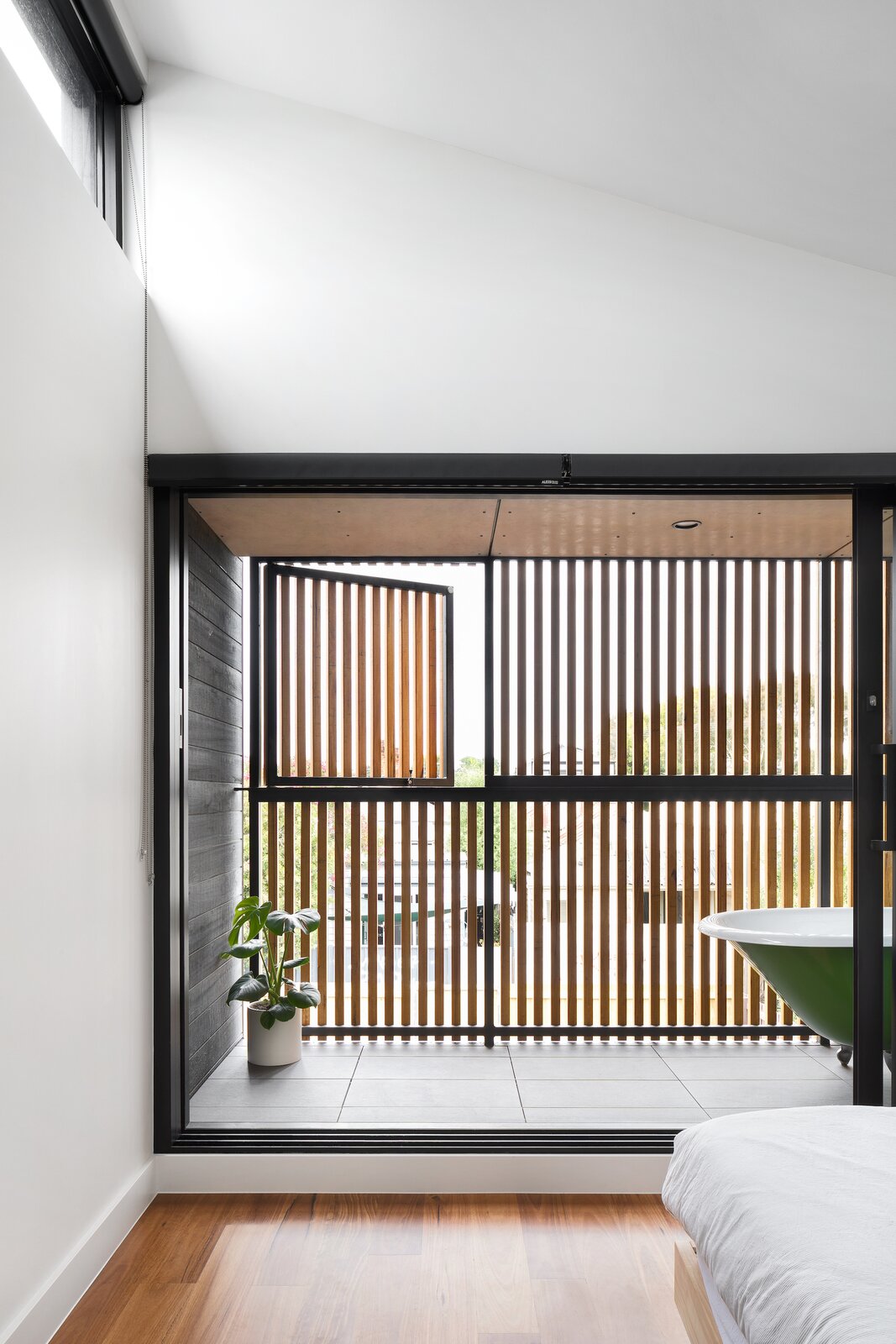 Photo 12 of 17 in A Balcony With a Bathtub Caps This Striking Prefab in ...