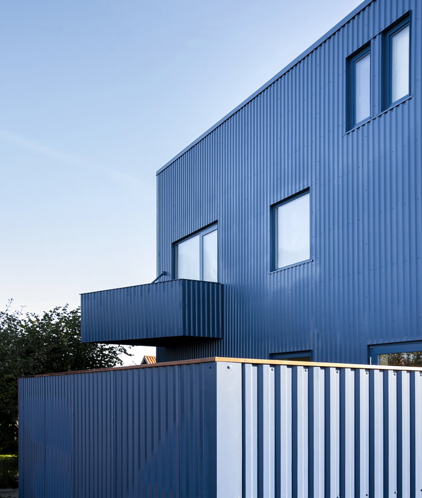 Photo 1 of 14 in A Blue House Clad With Corrugated Steel Blends Into ...