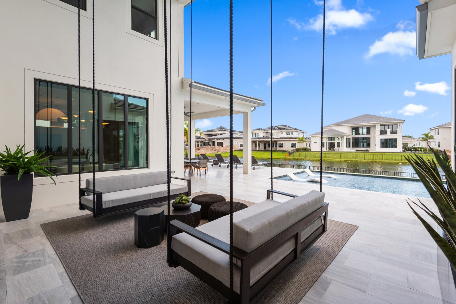 Photo 1 of 8 in Tour This Turnkey Mansion with Poolside Swings and ...