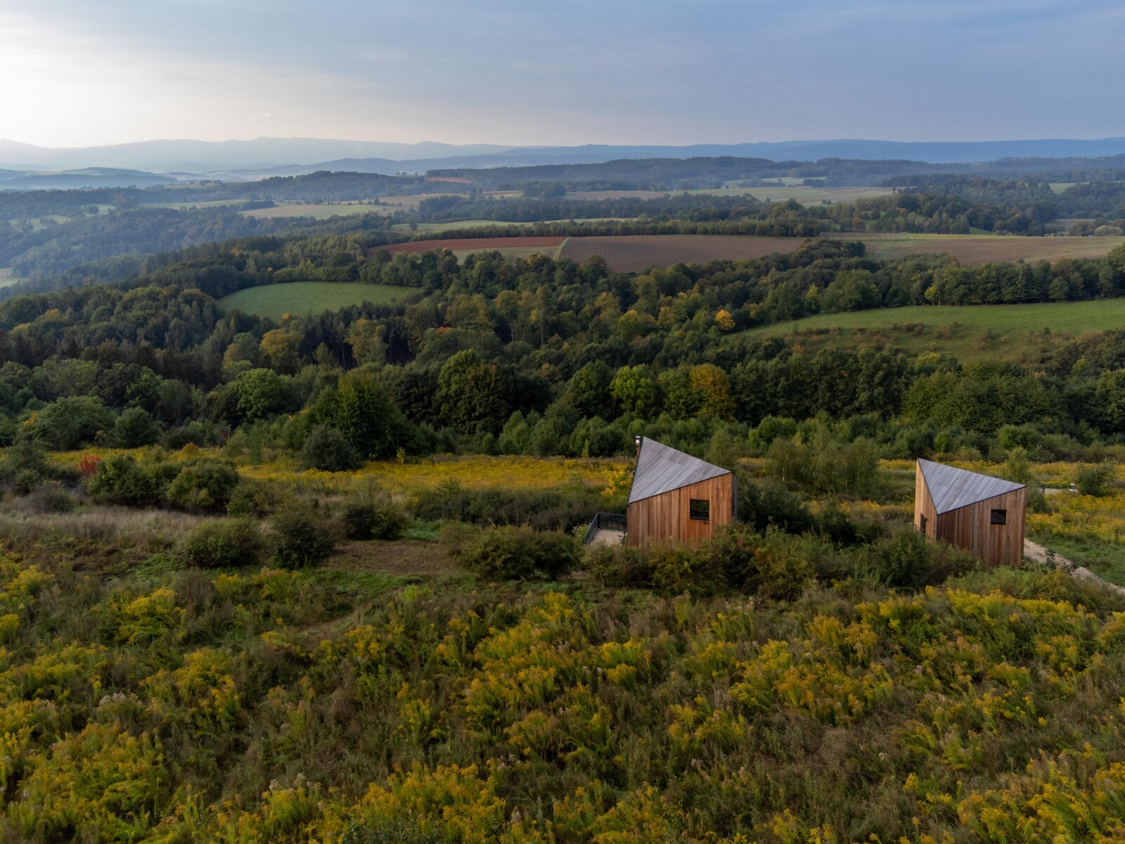 Photo 2 of 16 in Two Tiny Cabins Perched on Plinths Take In Valley ...