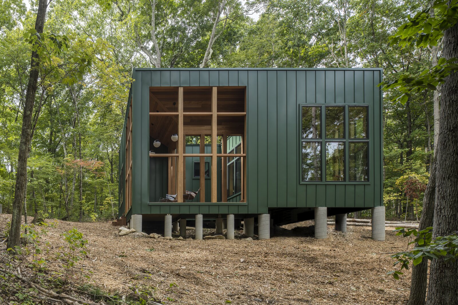 Photo 2 of 8 in A Metal-Clad Cabin Hovers Above the Forest Floor in ...