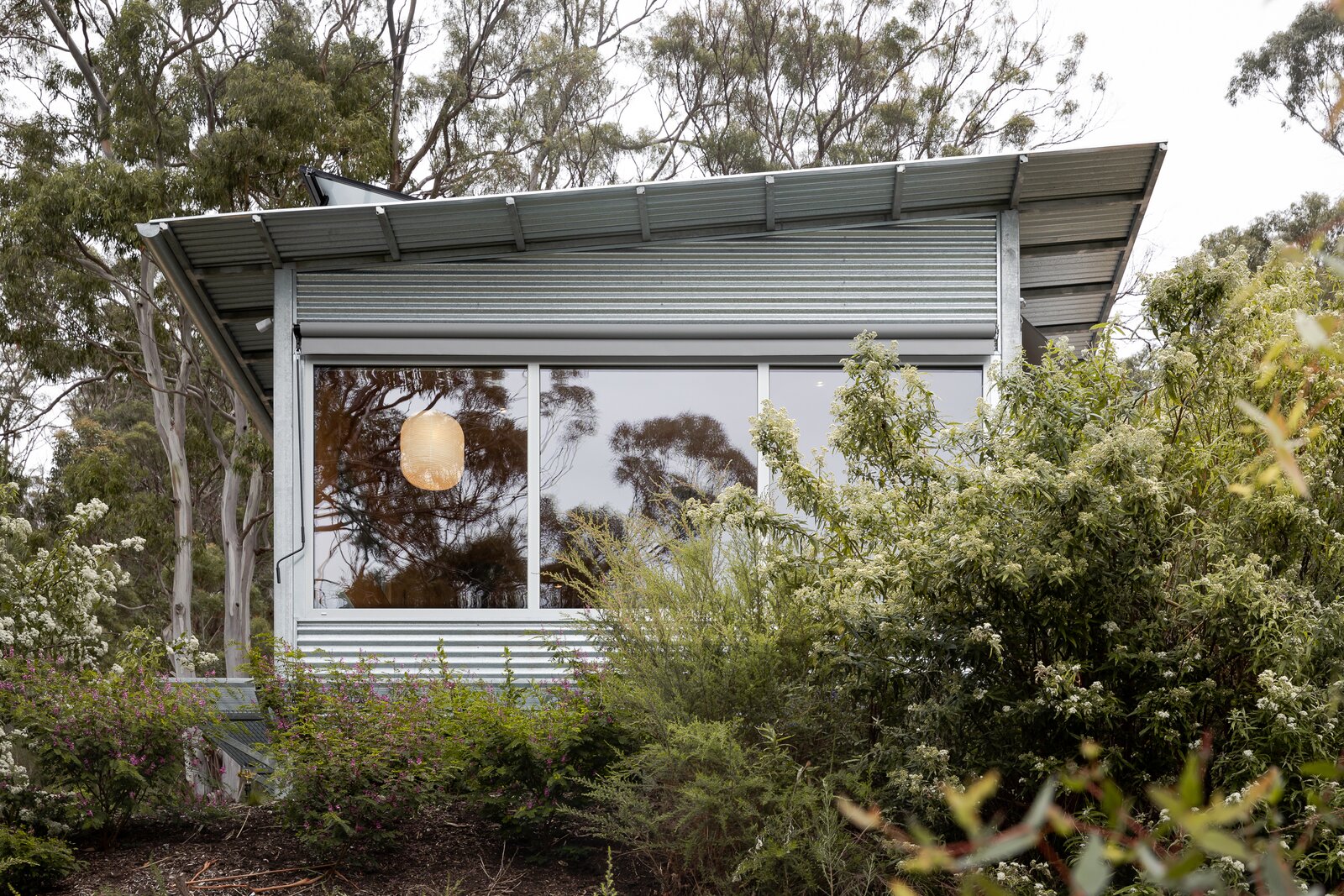 Photo 1 of 27 in A Corrugated Steel Shell Gives Way to Warm Timber ...