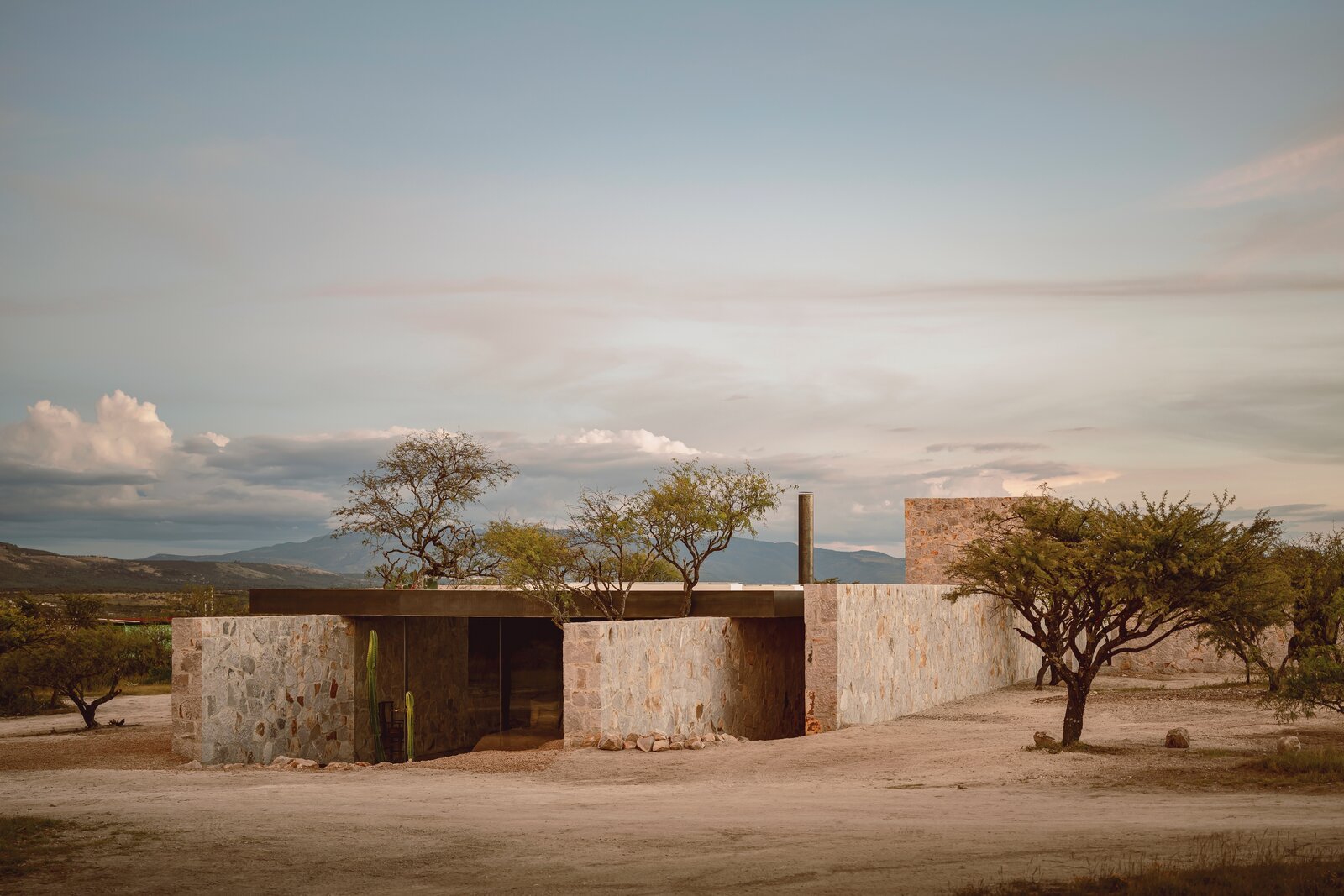 Photo 2 of 16 in In Mexico, Monolithic Stone Walls Make for a Home as ...