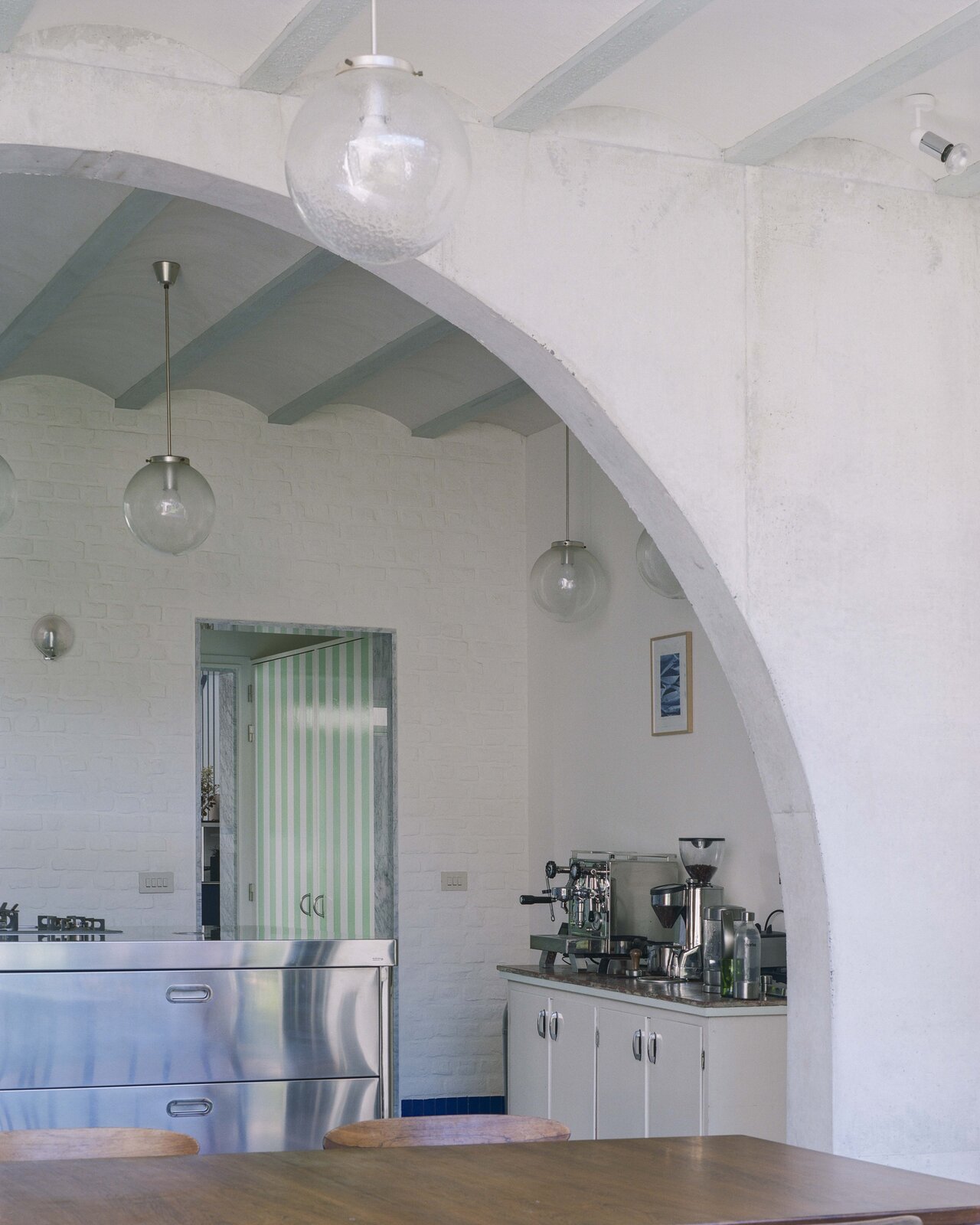 Photo 6 of 15 in Grooved Red Tile, Arches, and a Catwalk Tie Together a ...