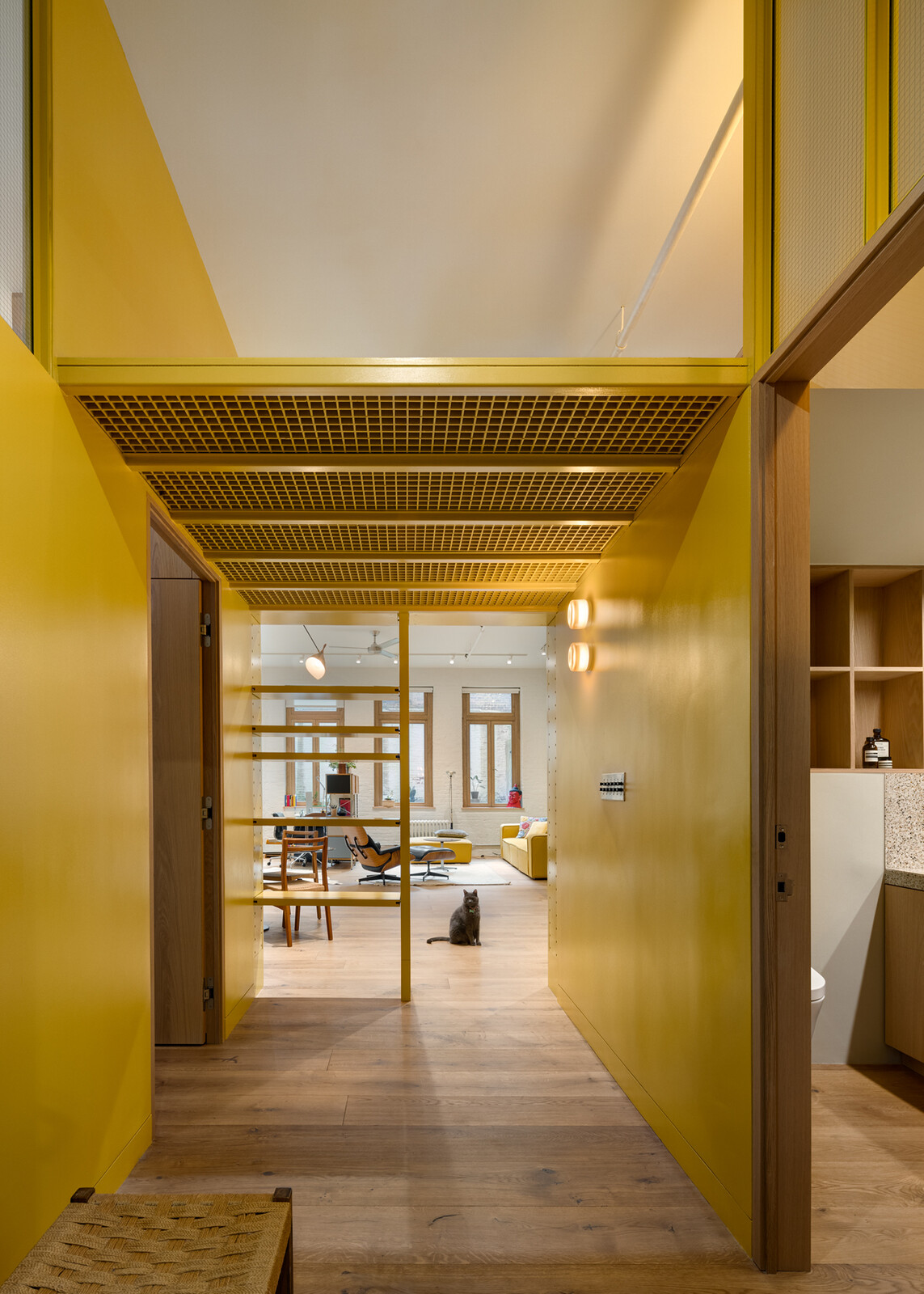 Photo 14 of 15 in A Yellow Floor-to-Ceiling Library Wall Brightens Up ...