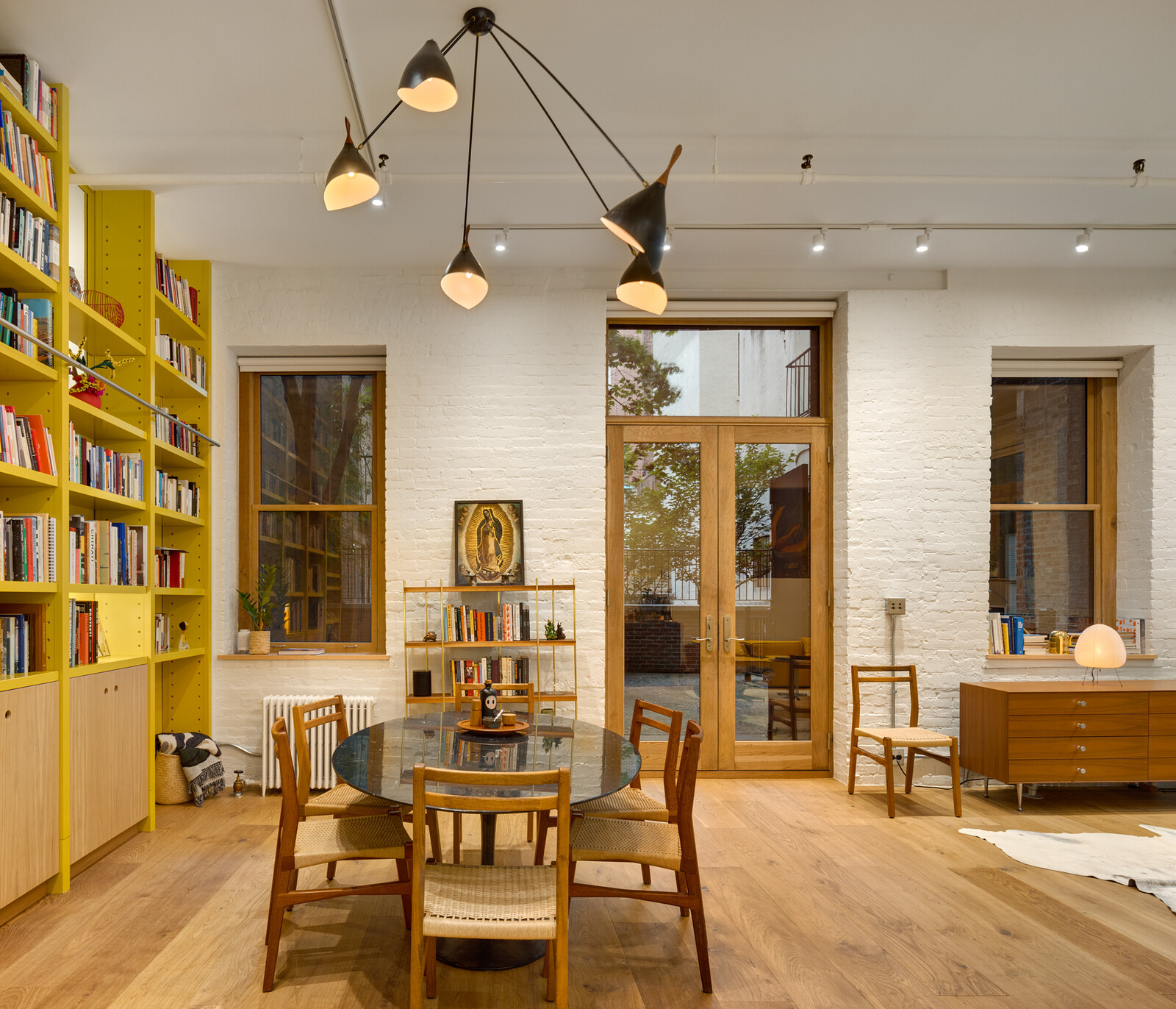 Photo 1 of 15 in A Yellow Floor-to-Ceiling Library Wall Brightens Up ...